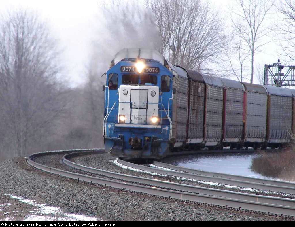 Ex-EMD demonstrator EMDX 9074 leads autoracks eastbound near Savage Rd